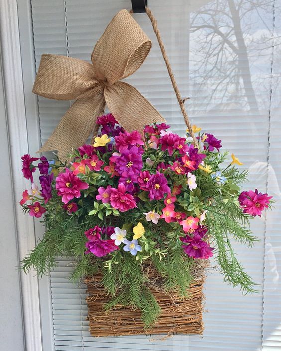 Beautiful spring decorations on the front door based on a wicker basket ...