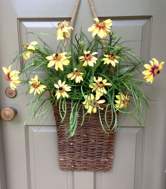 Beautiful spring decorations on the front door based on a wicker basket ...