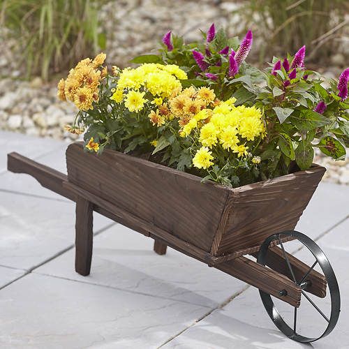 Even an old or broken wheelbarrow can be a beautiful garden decoration ...